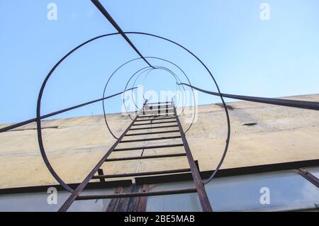 Evacuation staircase leading to a rooftop of a building. Fire exit from ...
