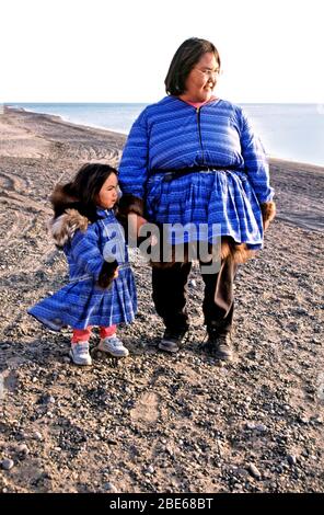Inuit woman with her baby in traditional Amauti dress in North Americas ...