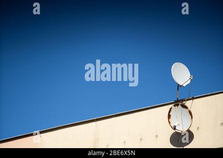 Round satellite dishes are receivers of electromagnetic waves ...