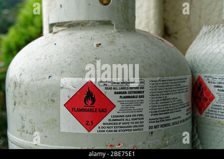 Hazard warning label on bottle of bleach sodium hypochlorite hydroxide ...