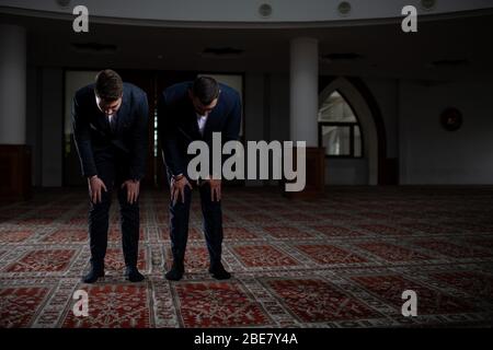 Two Attractive Man Making Traditional Prayer to God Allah in the Mosque ...