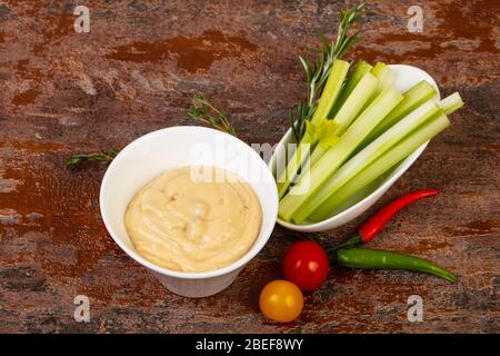 Vegan cuisine - Humus with celery sticks Stock Photo - Alamy