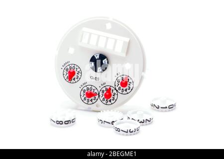 Internal mechanical parts from broken water meter isolated on the white ...