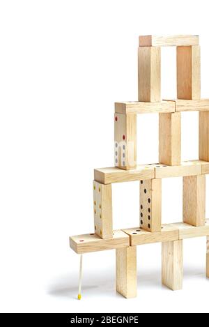 Dominoes pyramid building construction isolated on the white background ...