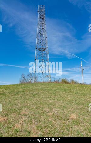Abandoned satellite dish broadcast antenna in a field with overgrown ...