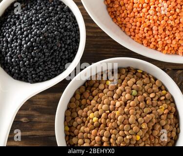 From above bowls with different types of rice placed on table near ...