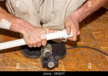 The water valve connects to a PVC pipe on the rooftop of a building for ...