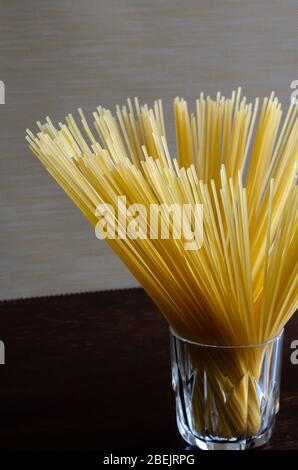 Italian unprepared pasta in a glass jar in the kitchen - fusilli Stock ...