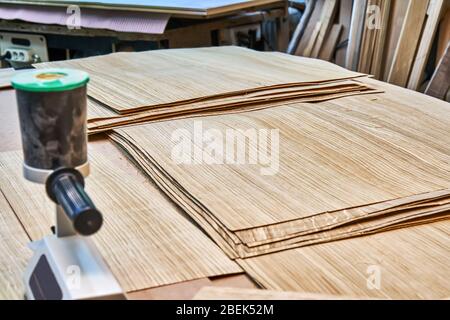 Oak veneer. Oak texture. Veneer splicing process with veneer hand ...