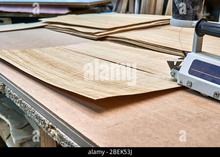 Oak veneer. Oak texture. Veneer splicing process with veneer hand ...