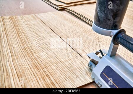 Oak veneer. Oak texture. Veneer splicing process with veneer hand ...