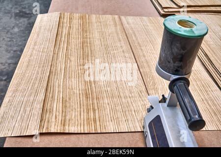 Oak veneer. Oak texture. Veneer splicing process with veneer hand ...