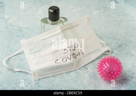 cologne and white disposable surgical mask against covid-19 corona ...