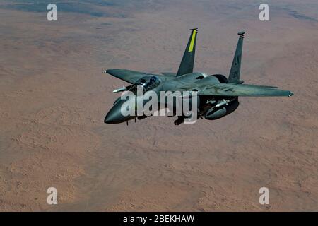 An F-15 Eagle aircraft flies a patrol over the desert during the cease ...