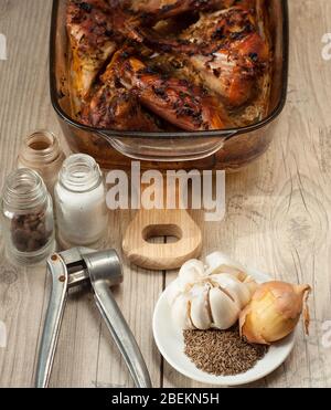 rabbit meat roaster with onion cumin and garlic on wooden vintage table ...