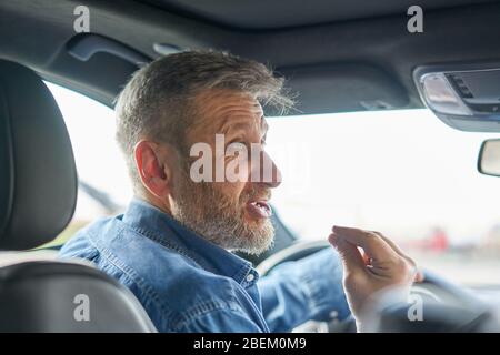 Aggressive and crazy driver in his car Stock Photo - Alamy