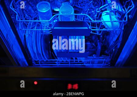 Cologne, Germany. 13th Apr, 2020. Washed dishes are in an open ...