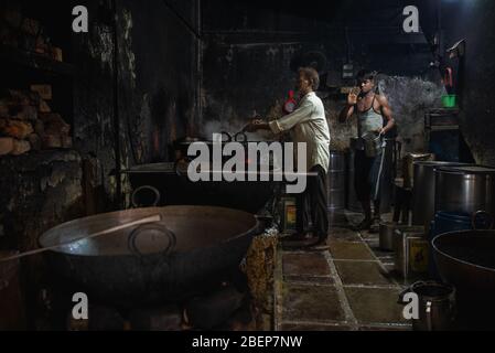 Indian cook in indian kitchen, India, Andaman Islands, Havelock Island ...