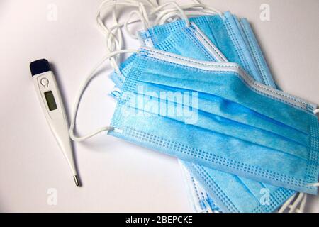 Medical disposable respiratory masks on striped background Stock Photo ...