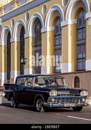 Vintage car passing by the Sauto Theater, Matanzas, Matanzas Province ...