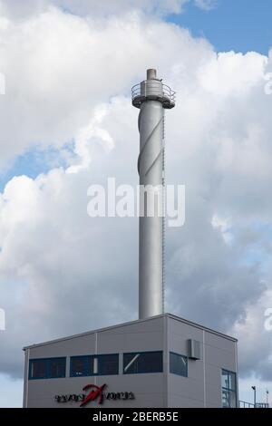Helical strakes or corkscrew fin at the top of a district heating power ...