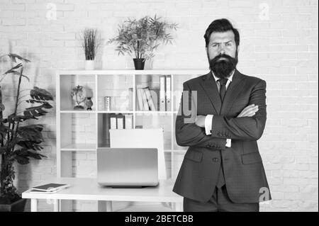 office manager in formal fuit. serious and mature boss at workplace ...