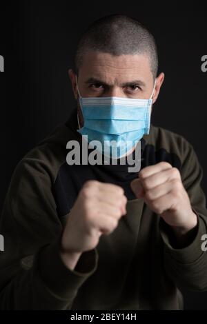 Fight for health care concept. Fist in fight position holding ...