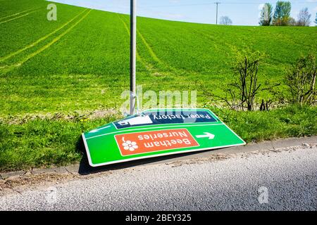 Knocked over and abandoned road sign UK Stock Photo - Alamy