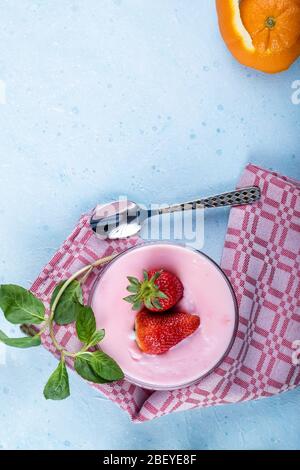 Bowl of delicious vanilla pudding with fruits on light background ...