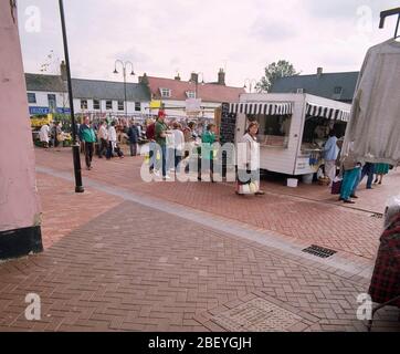 1992, Ely town Centre, and market place, east England, UK with people ...