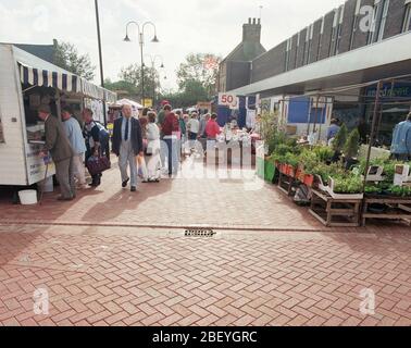 1992, Ely town Centre, and market place, east England, UK with people ...
