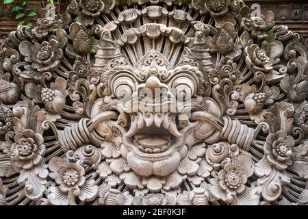 Stone carved demon Kala in Balinese Hindu temple Pura Taman Kemuda ...