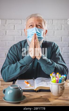 Mask and bible Stock Photo - Alamy