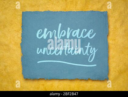 embrace uncertainty motivational note - handwriting on a napkin with a ...