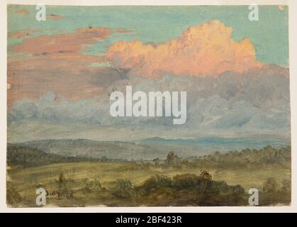 The gentle slope of a high hill with low sparse grass under a cloudy ...