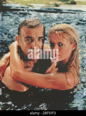 KIM BASINGER and SEAN CONNERY as James Bond 007 on horseback in NEVER ...