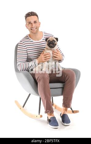 Handsome man with cute pug dog on color background Stock Photo - Alamy