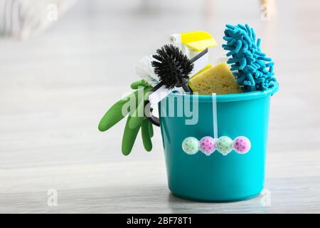 Set of cleaning supplies on floor in room Stock Photo - Alamy