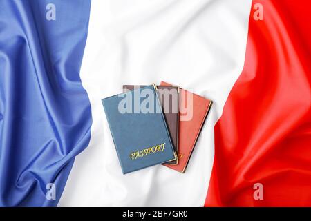 Passports on flag of France. Immigration concept Stock Photo - Alamy