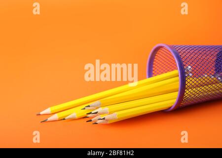 Ordinary pencils on color background Stock Photo - Alamy