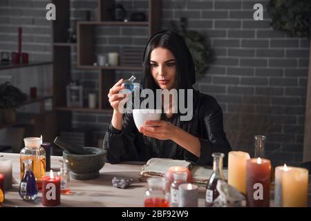 Female alchemist making elixir in laboratory Stock Photo - Alamy