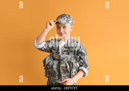 Cute little soldier on color background Stock Photo - Alamy