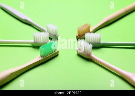 Many tooth brushes on color background Stock Photo - Alamy