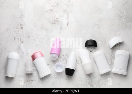 Different deodorants on light background, top view. Skin care Stock ...