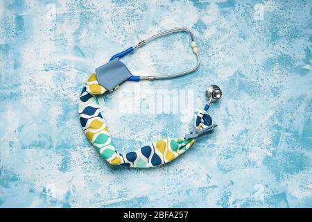 Stethoscope with cover on color background Stock Photo - Alamy
