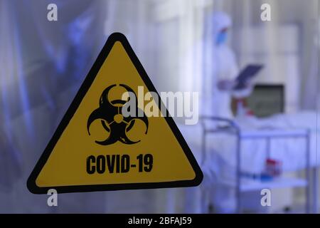 Biohazard warning sign on door of contagious isolation ward. Concept of ...