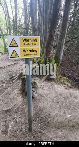 Warning sudden drop water hazard sign Stock Photo - Alamy