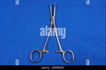 Curved haemostatic clamp. This is used to occlude blood vessels. There ...