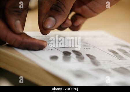 A suspect has their fingerprints taken Stock Photo - Alamy