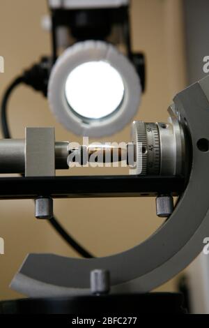 Forensic ballistics test. Crime scene bullet cartridge being examined ...